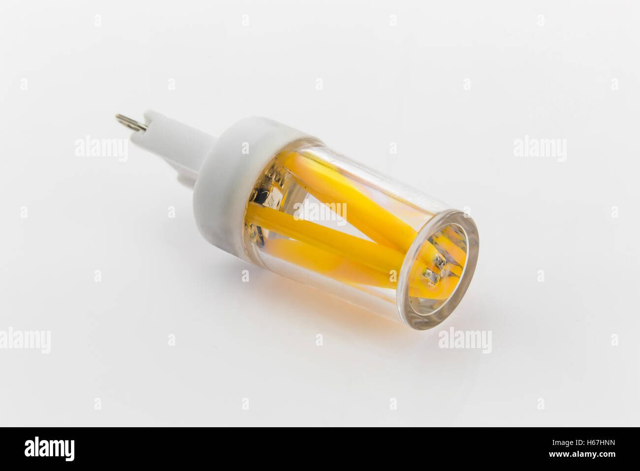 small simmaable G9 LED bulb with four filaments Stock Photo - Alamy