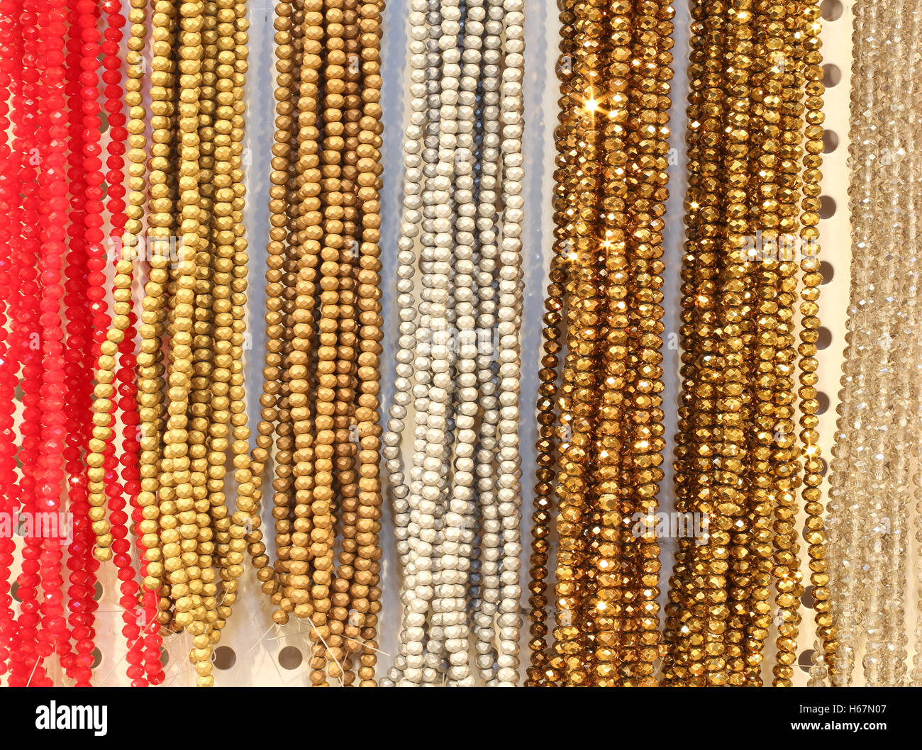 Many beautiful shimmering necklaces made with pearls and colorful ...