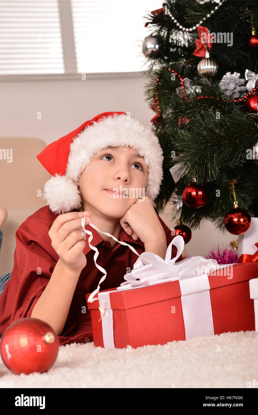 Happy kid celebrating christmas Stock Photo - Alamy