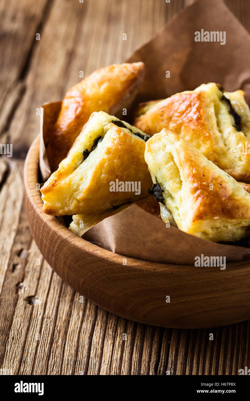 Spinach and cheese puff pastries triangles Stock Photo - Alamy