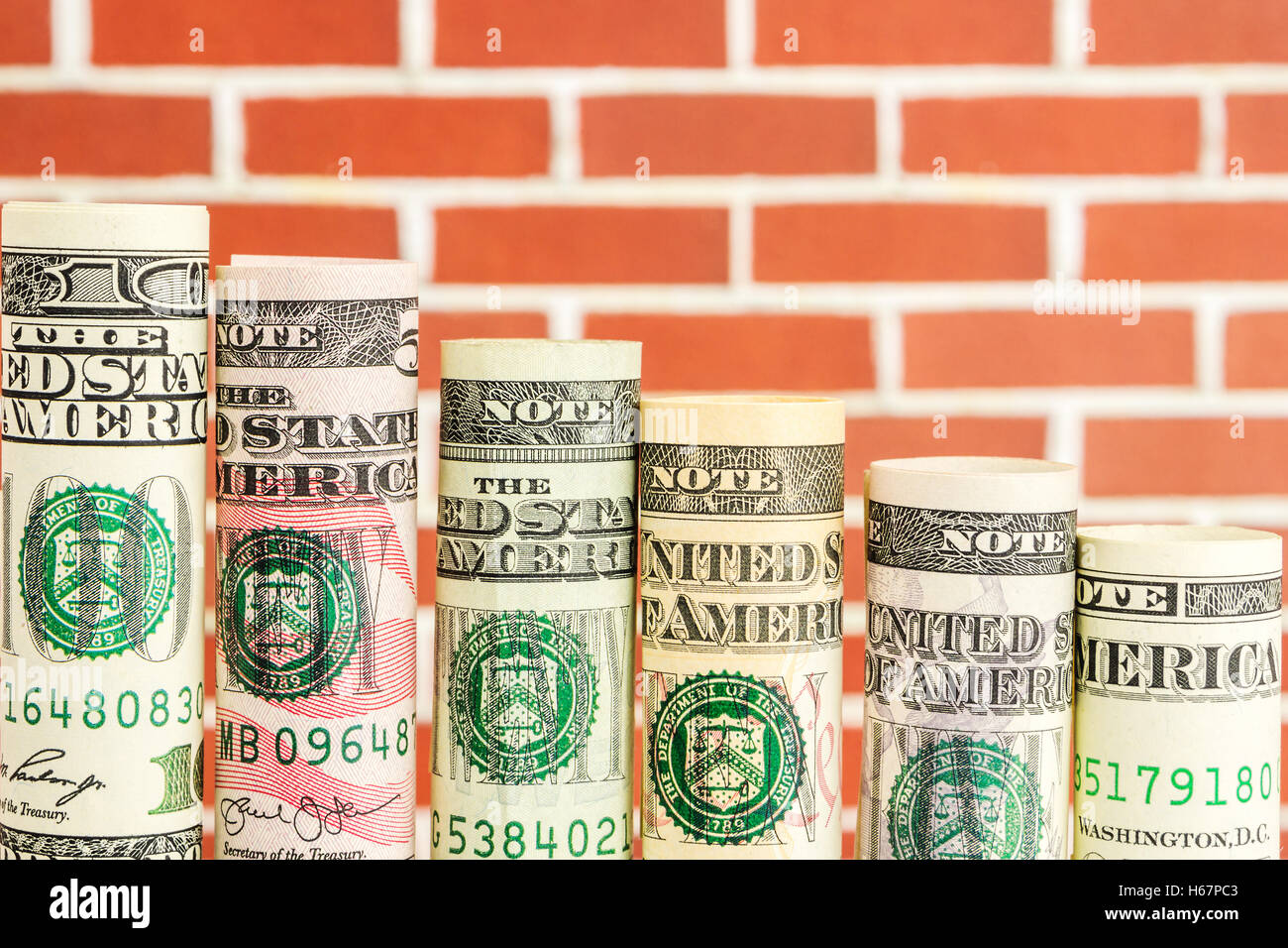 declining steps made of rolls of all american dollar banknotes in one ...