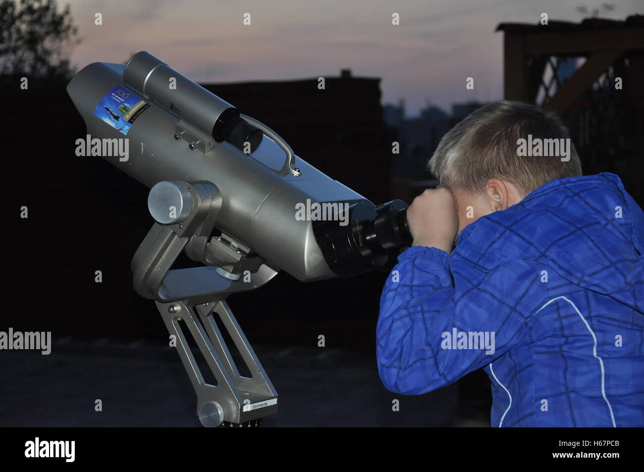 Child with binoculars, astronomy, space, observation Stock Photo - Alamy