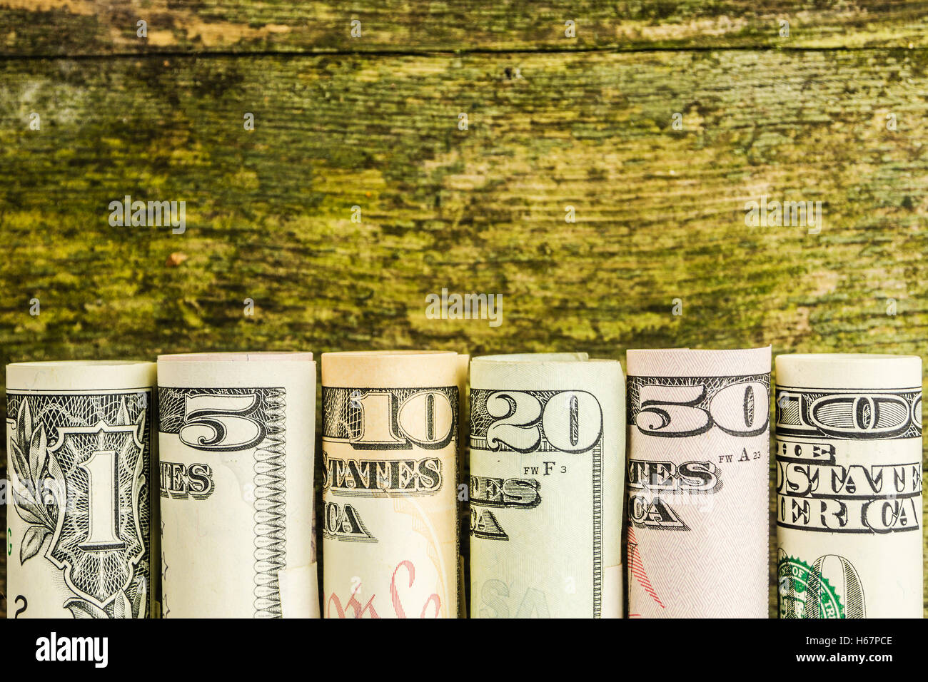 american dollar banknote rolls in all denominations in one row on old ...