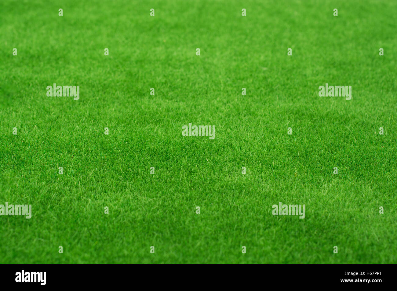Fake green grass for use as nature background Stock Photo - Alamy