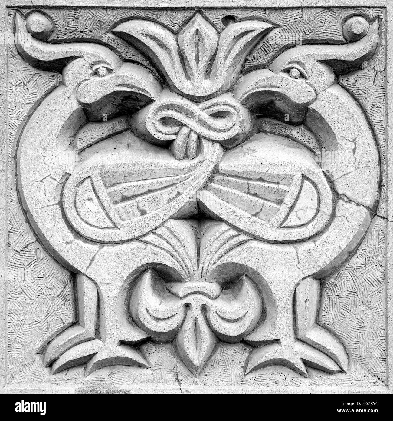 two fairy fire birds, stone bas-relief on the wall Stock Photo - Alamy