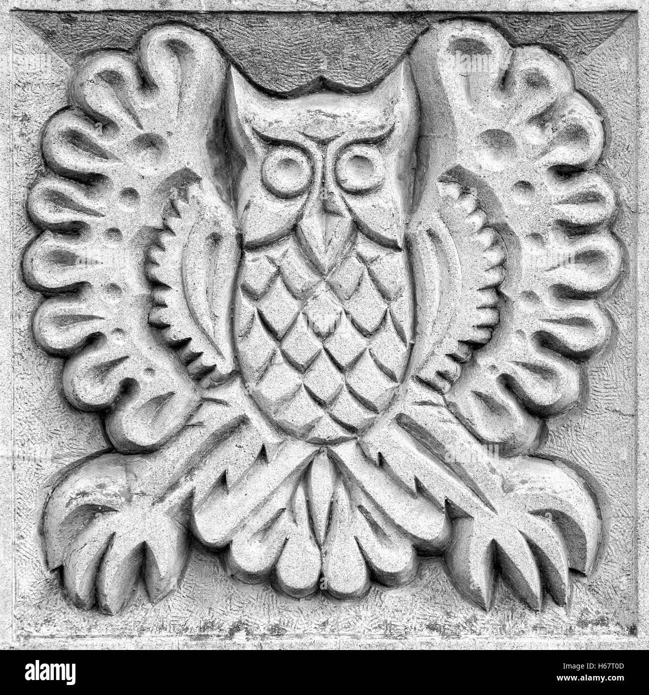 fabulous big owl, a stone bas-relief on the wall Stock Photo - Alamy