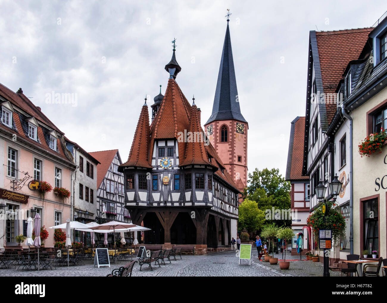 Gothic style Town Hall, Rathaus with turrets on roof and coat of arms ...