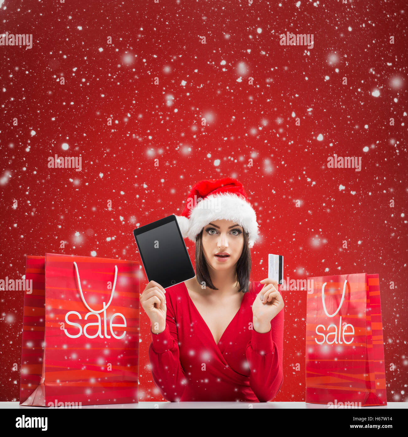 Santa Women with tablet and credit card Stock Photo - Alamy