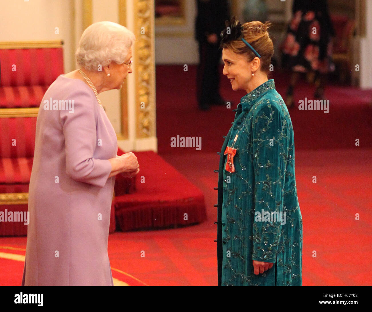Is made an mbe by the queen at buckingham palace hi-res stock ...