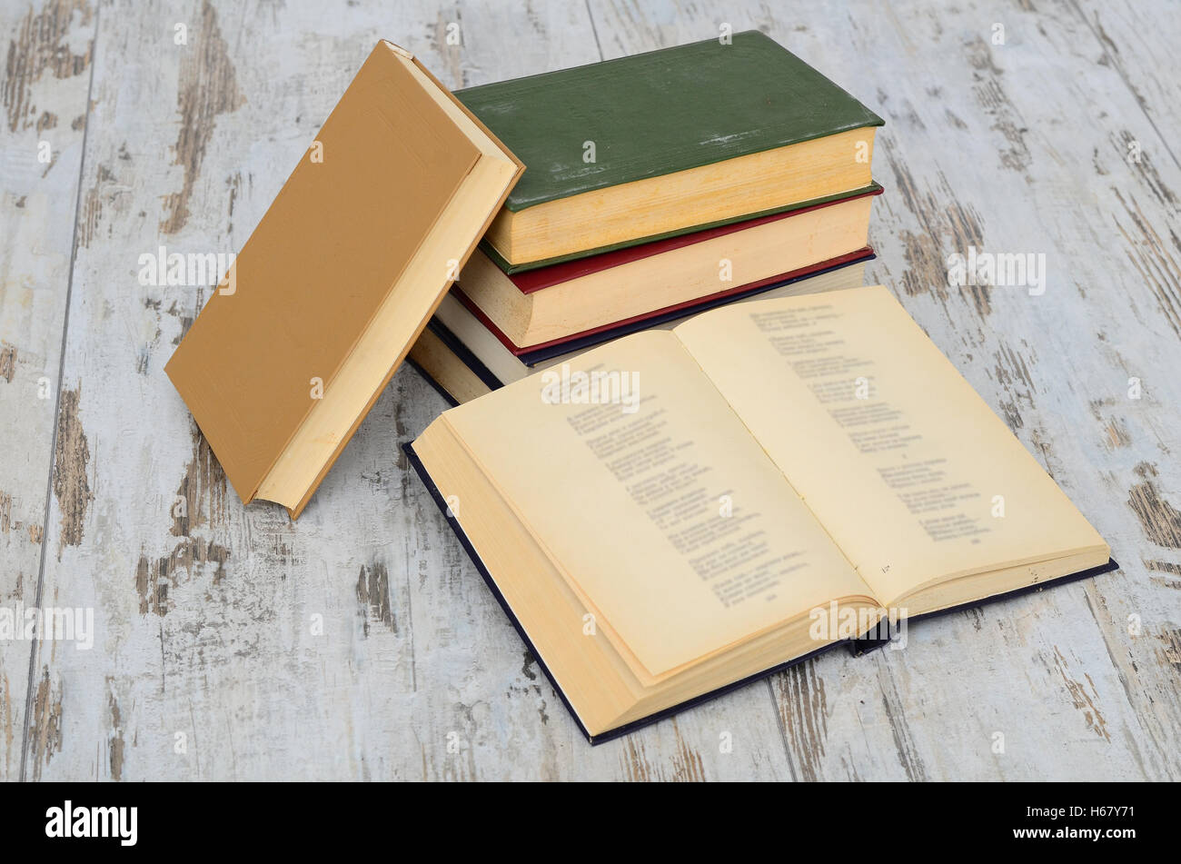 Vintage book, open, on old wooden table Stock Photo - Alamy
