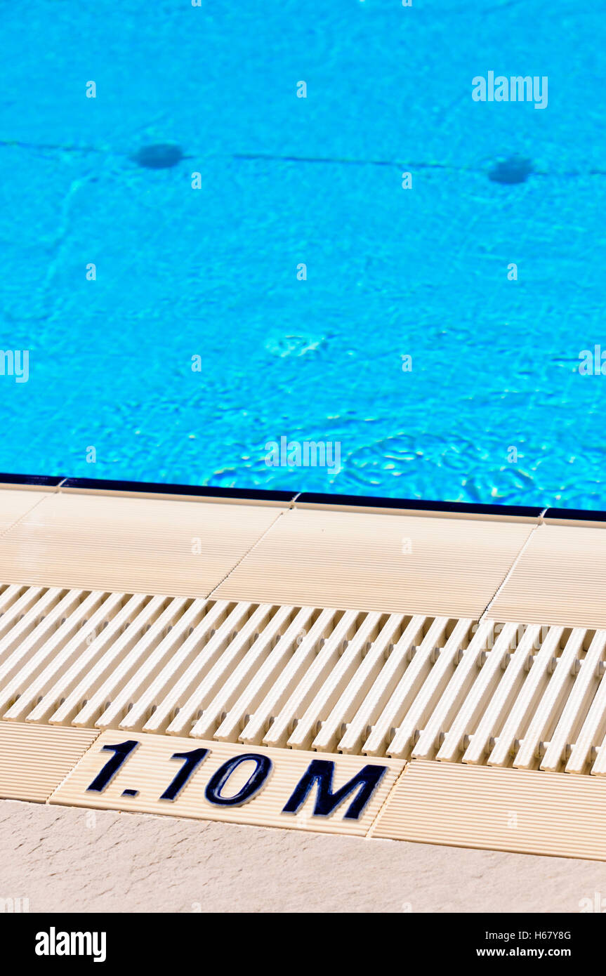 1.10m depth indicator at a swimming pool Stock Photo - Alamy