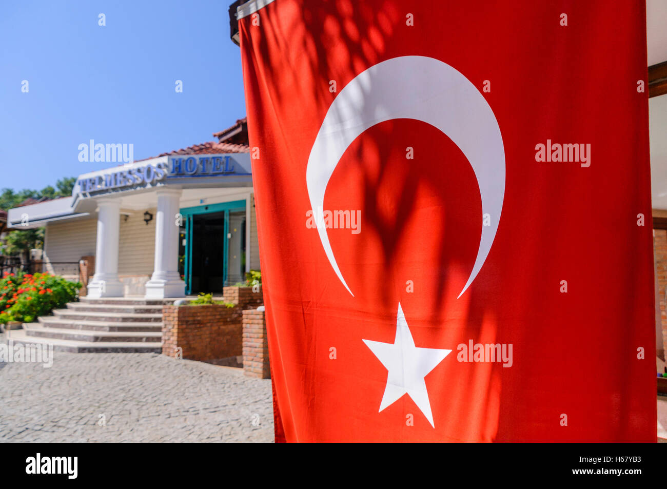 Turkish flag hanging outside a hotel Stock Photo - Alamy