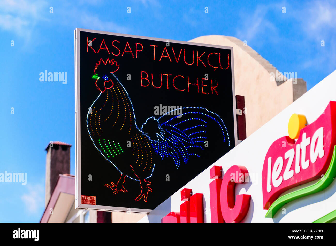 LED sign with a chicken at a Halal butchers in Turkey Stock Photo - Alamy