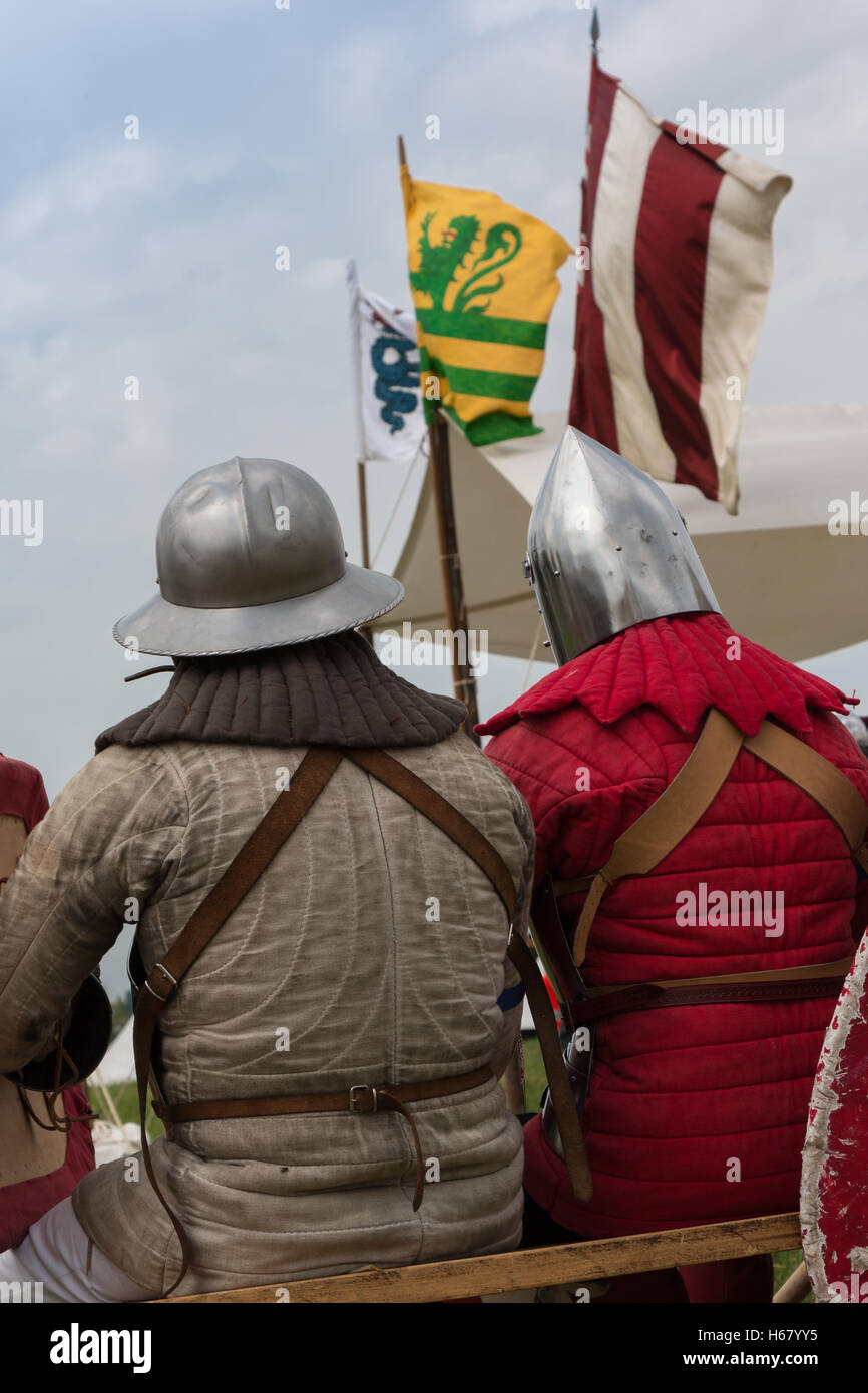 Knights with Silver Helmets and Shields seated on Chair: Medieval Event ...