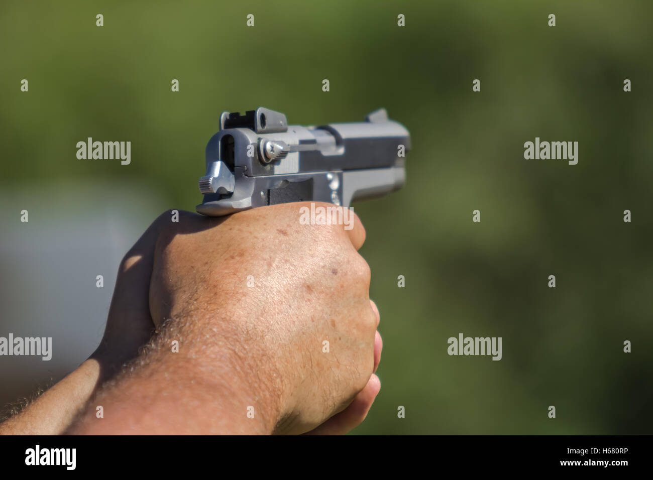Shooting weapons at the gun range Stock Photo - Alamy