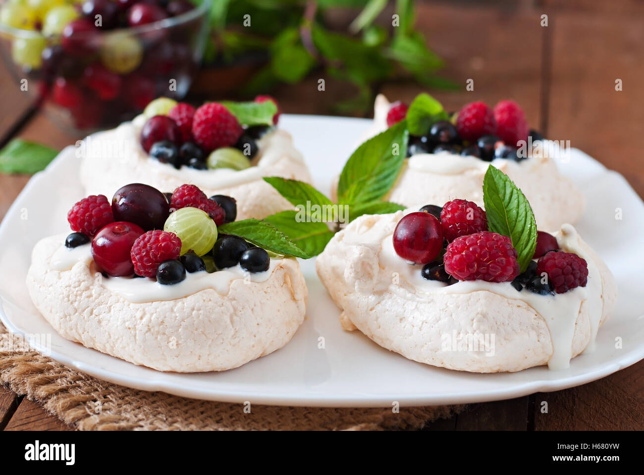 Meringue Cake "Pavlova" with cream and berries Stock Photo - Alamy