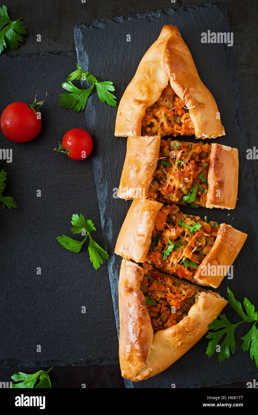 Turkish pide traditional food with beef and vegetables. Top view Stock ...