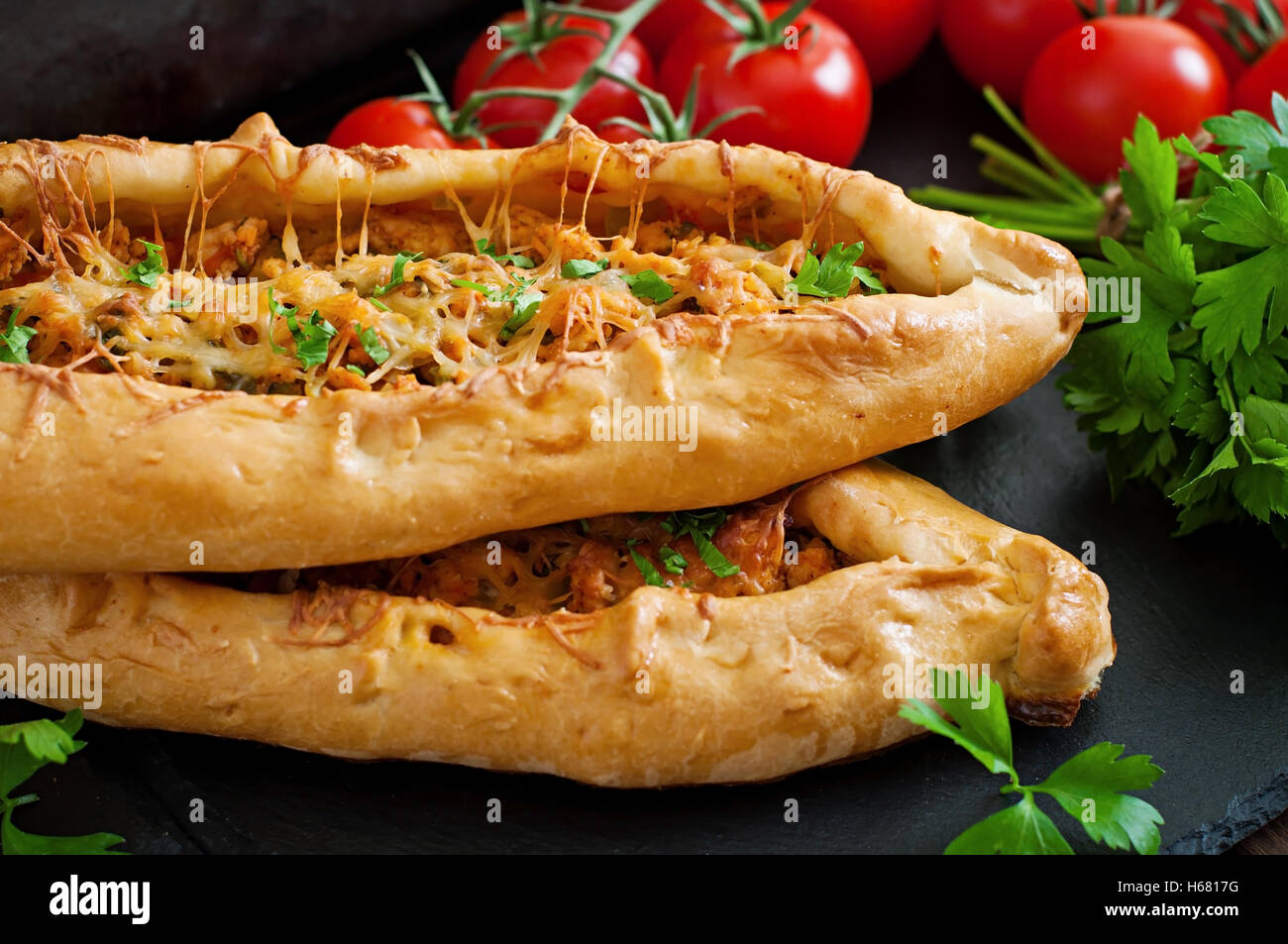 Turkish pide traditional food with beef and vegetables Stock Photo - Alamy