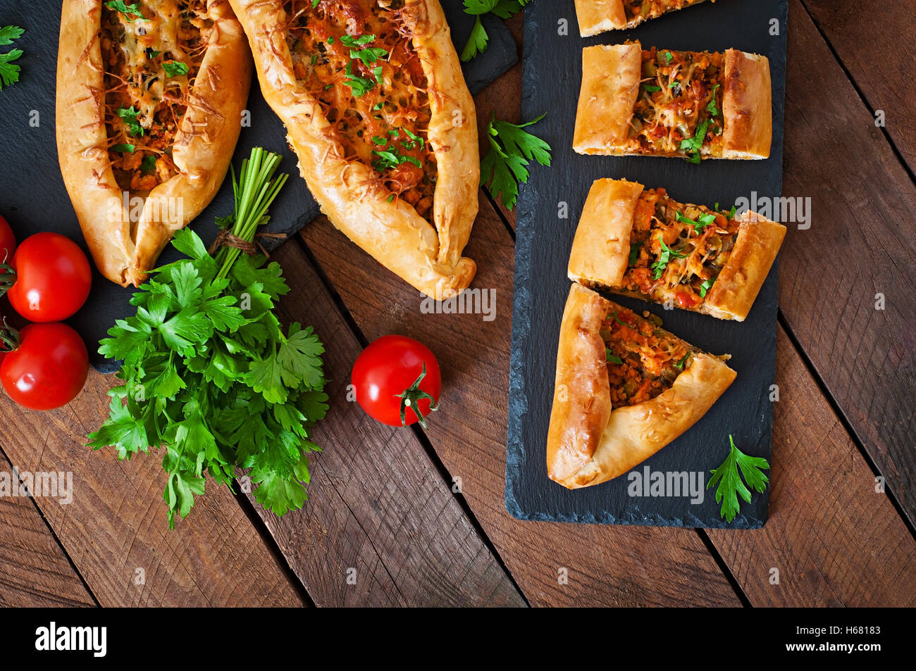Turkish pide traditional food with beef and vegetables. Top view Stock ...