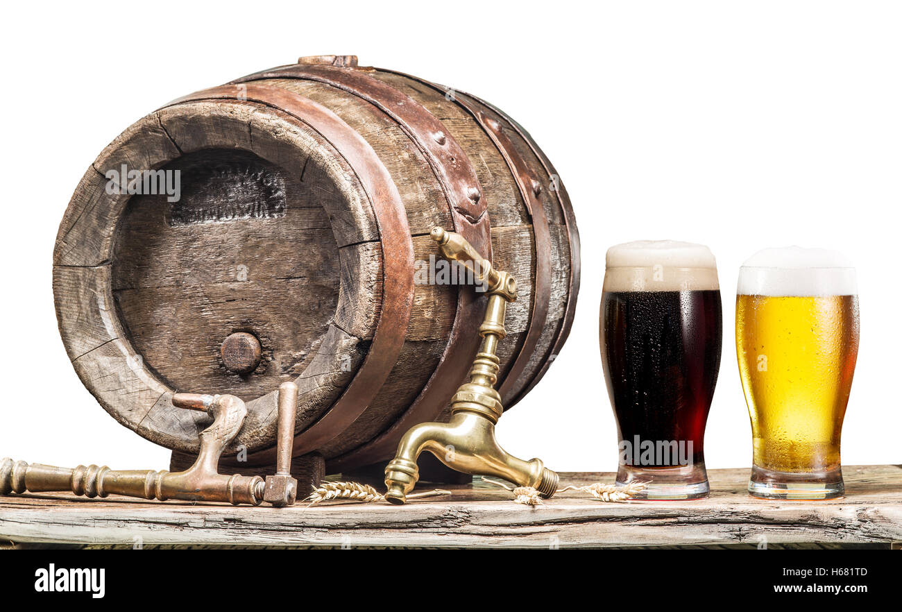 Glasses of beer and ale barrel on the wooden table. Craft brewery ...
