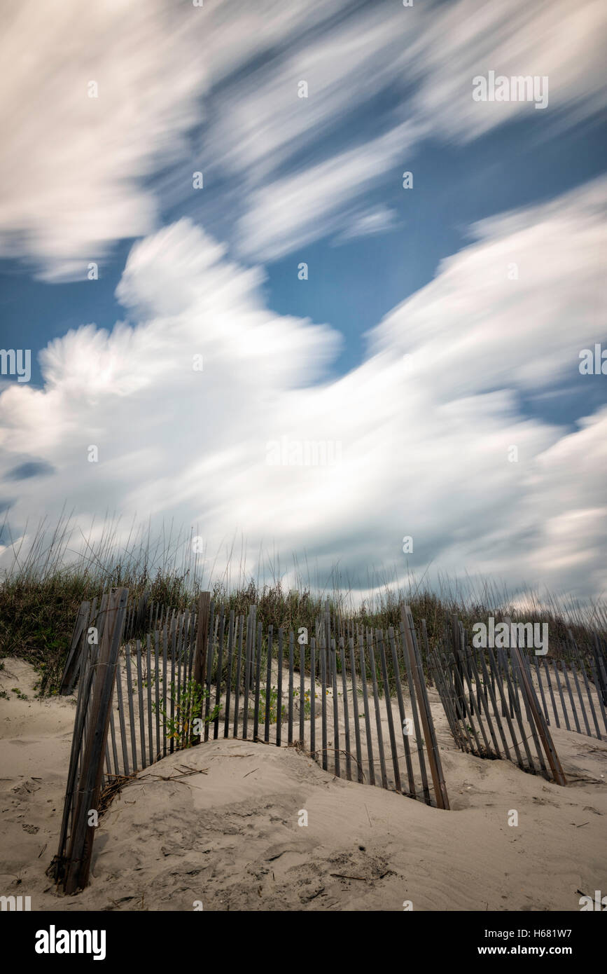 Cloud Movement and Dune Fences Stock Photo - Alamy