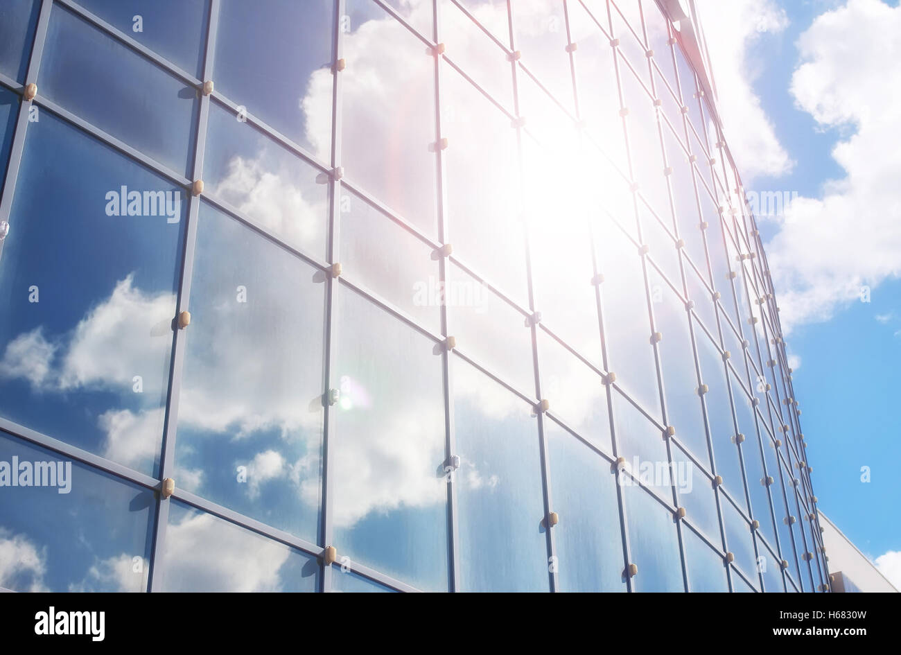 the sun and the sky in a glass building Stock Photo - Alamy