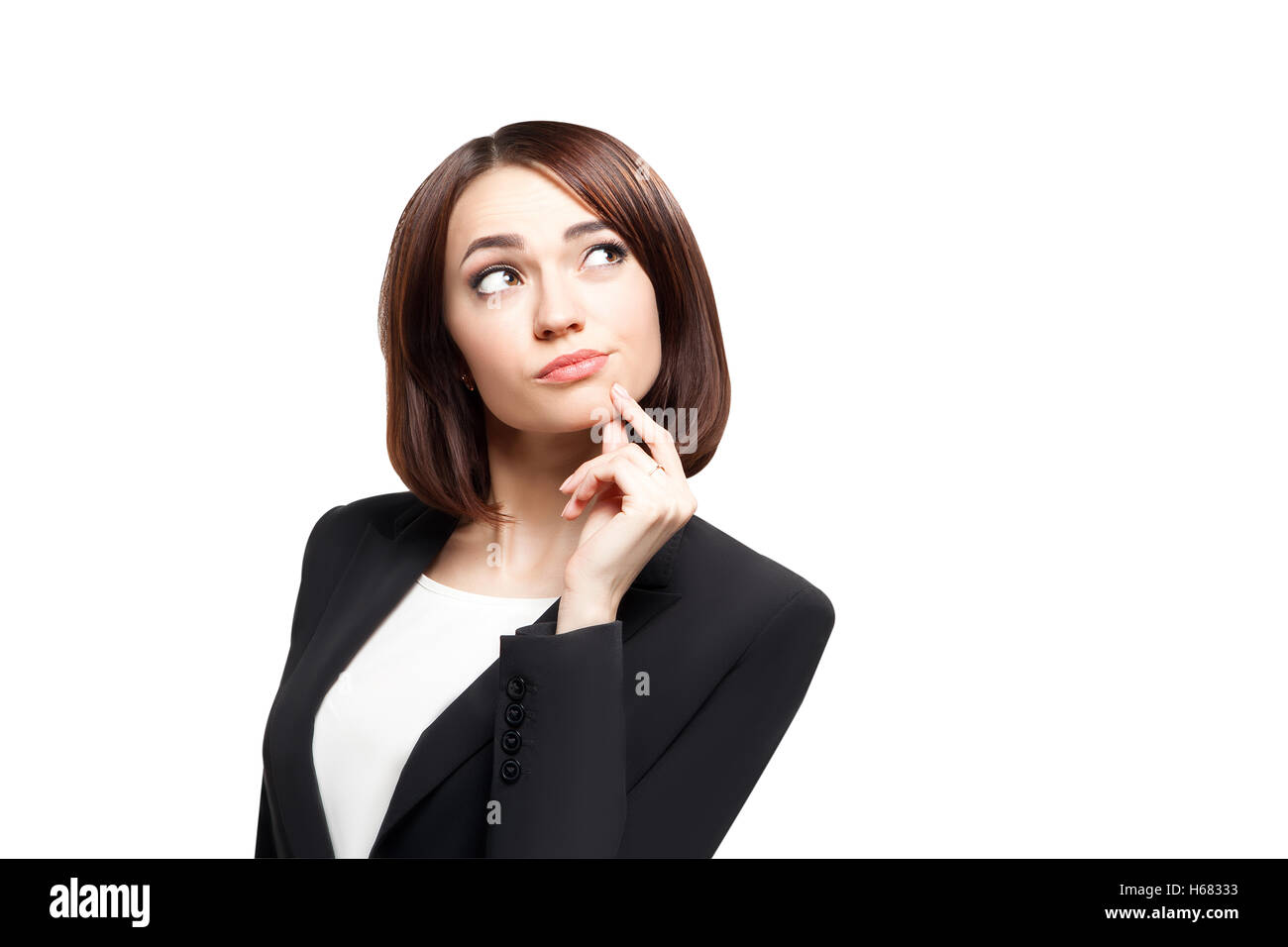 Beautiful thinking business woman isolated Stock Photo - Alamy