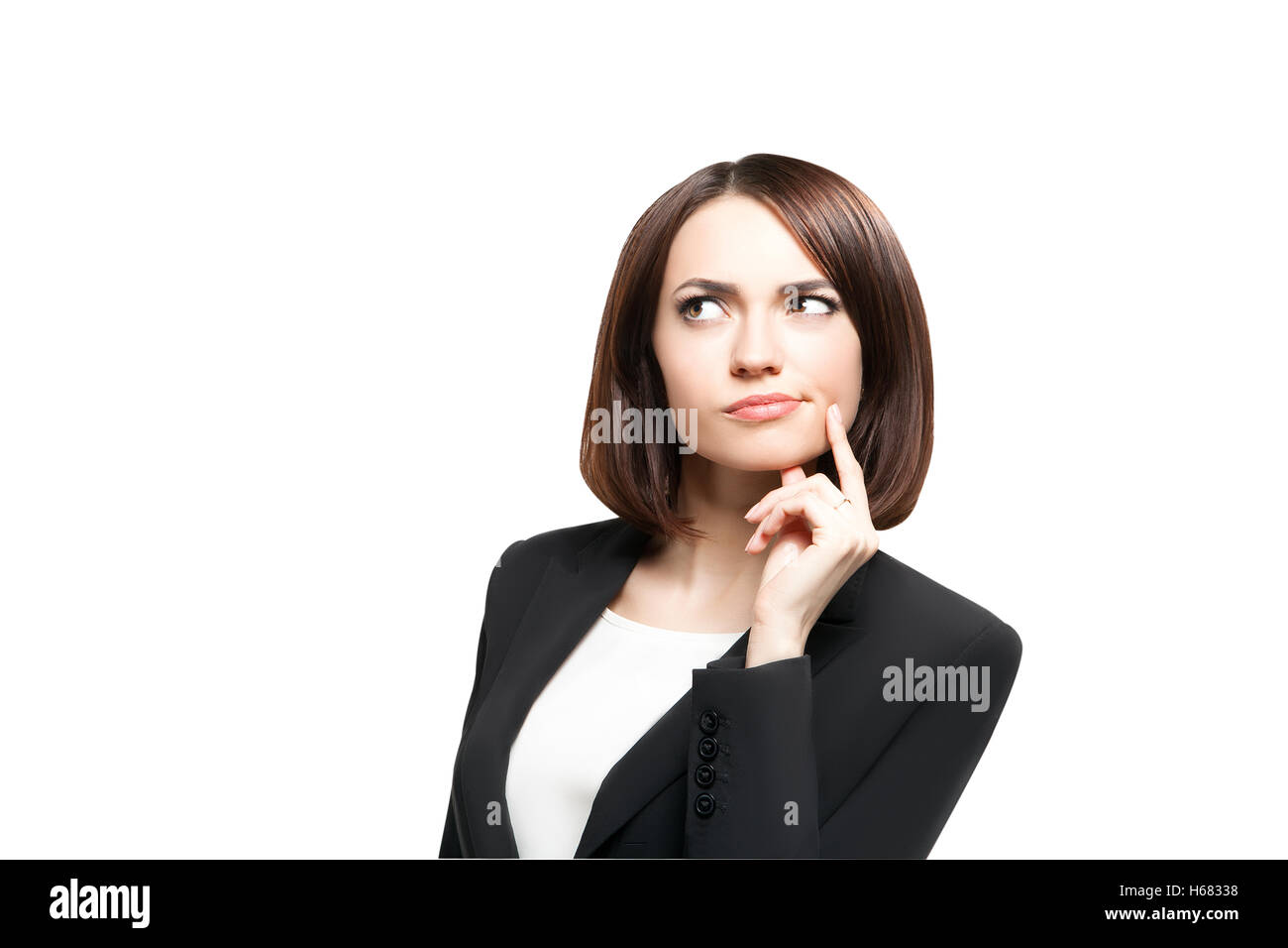 Beautiful thinking business woman isolated Stock Photo - Alamy