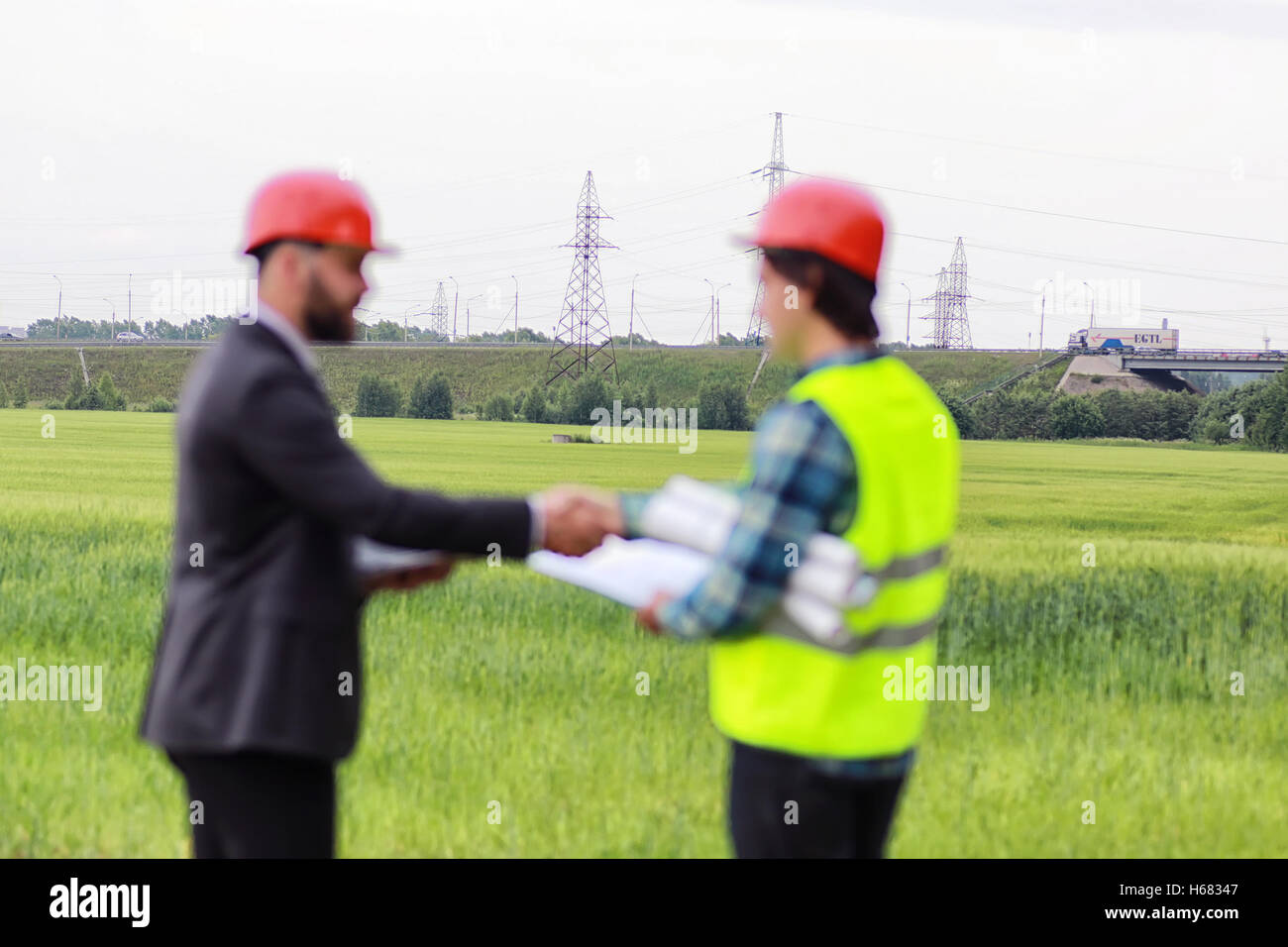 construction two man in the field Stock Photo - Alamy
