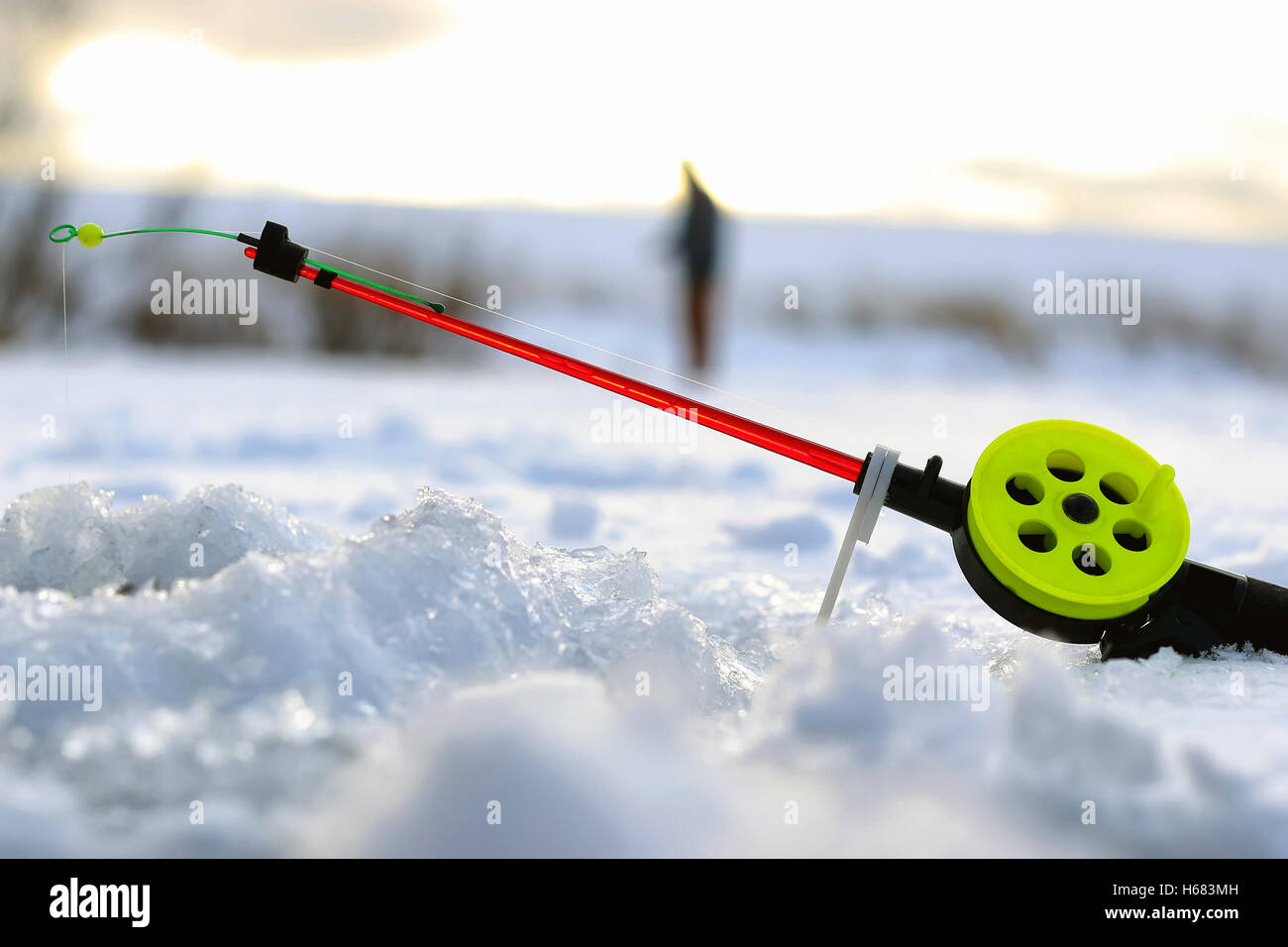 Little winter fishing rod ice Stock Photo - Alamy