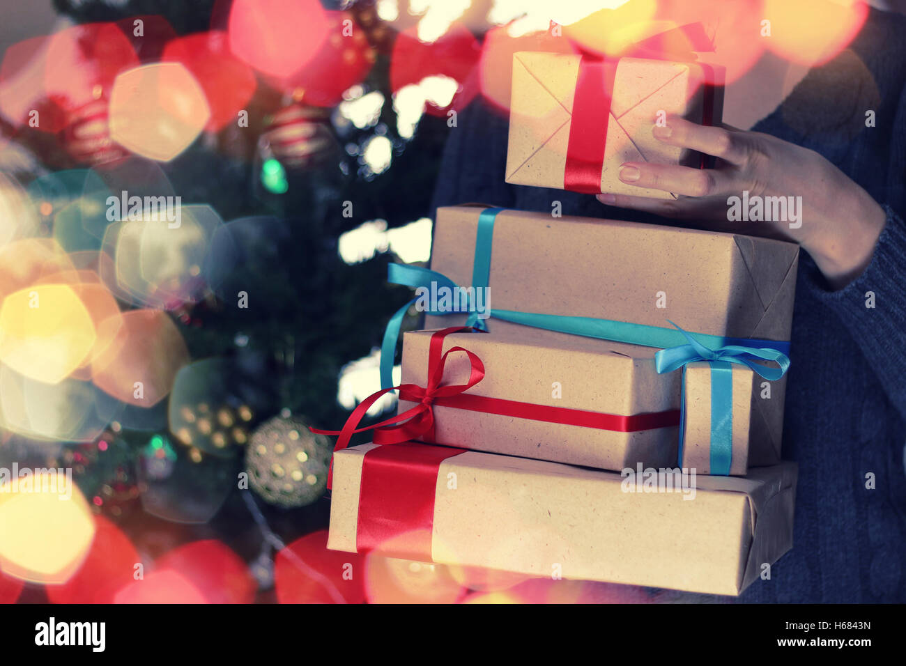 gift stack hand christmas Stock Photo - Alamy