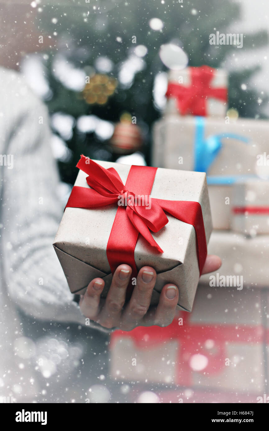 gift giving hand christmas Stock Photo - Alamy