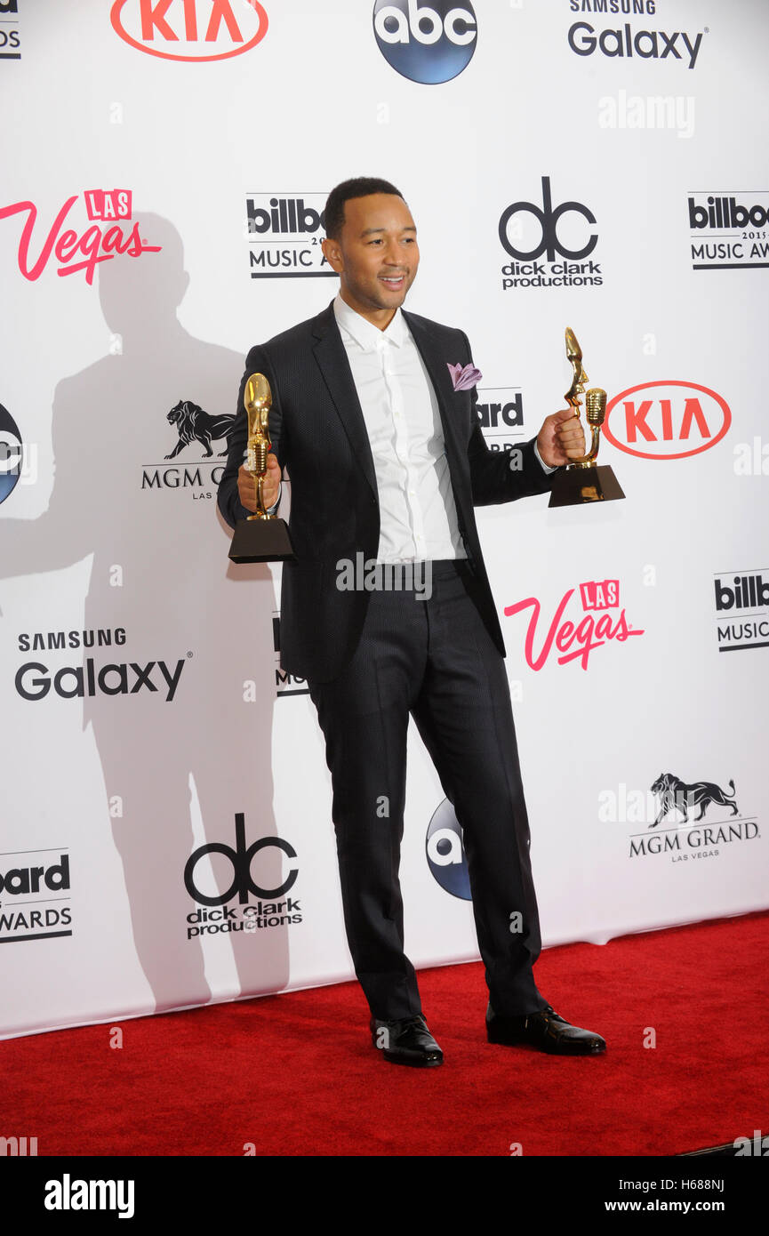 Singer John Legend poses with 2 awards at the 2015 Billboard Music ...
