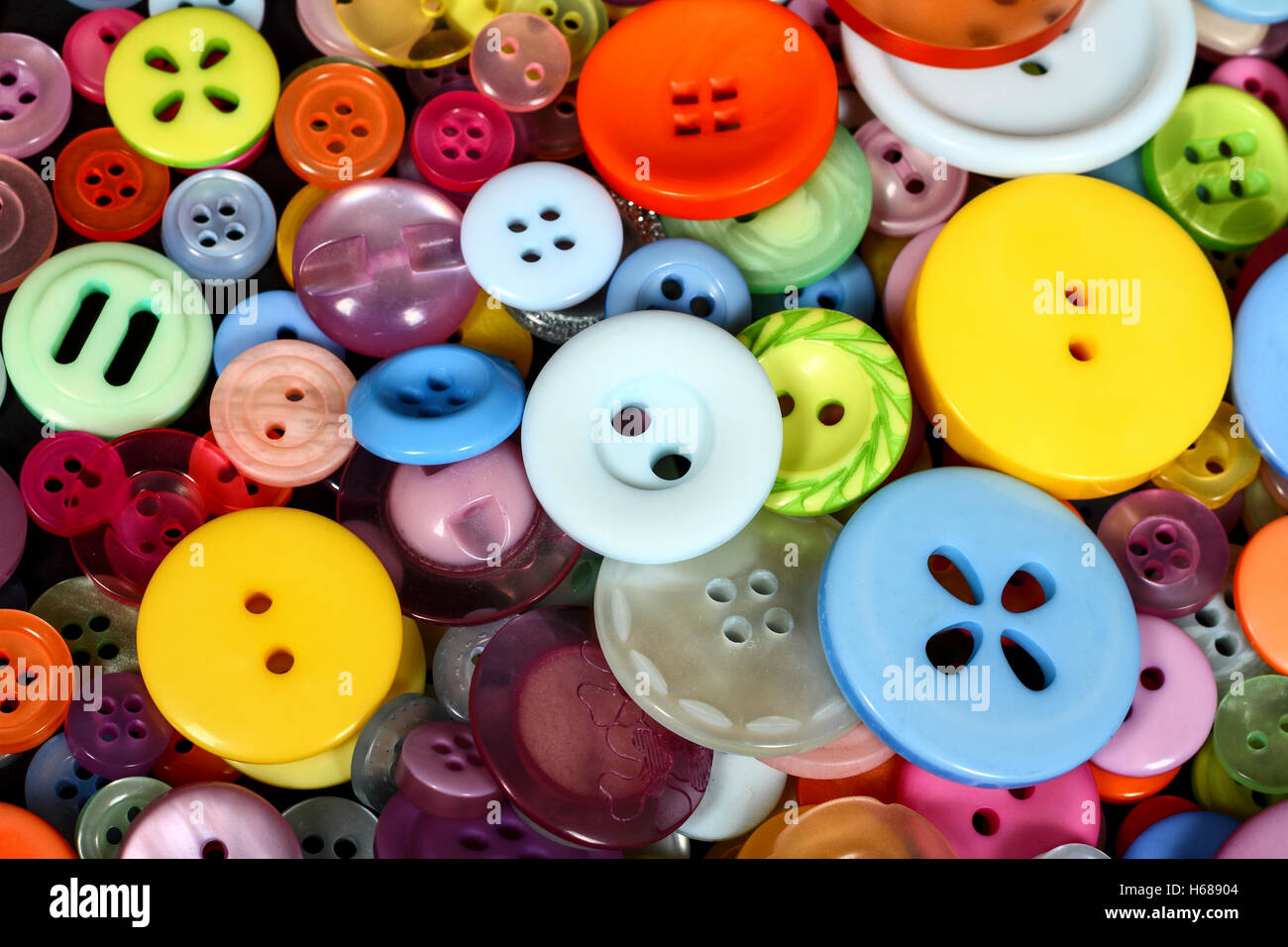 Selection of colourful plastic sewing buttons Stock Photo - Alamy