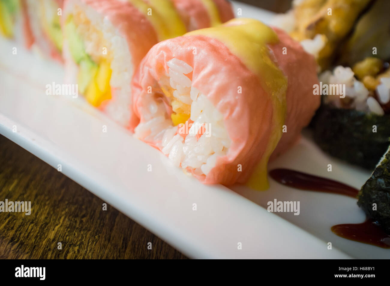 Pink rice paper butterfly sushi roll with avocado Stock Photo - Alamy