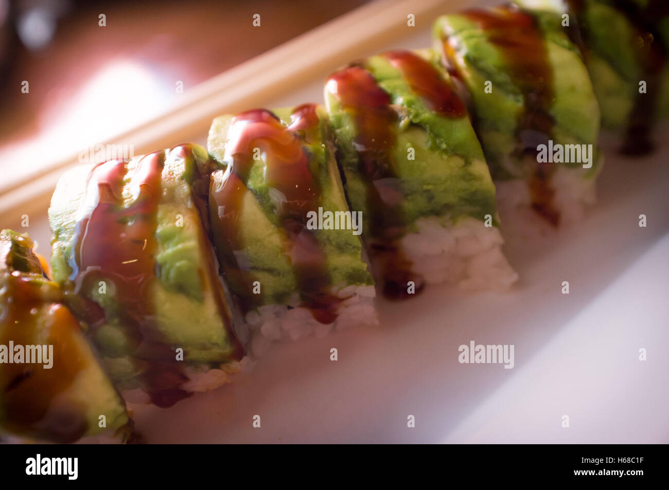 Eel avacado dragon roll with sushi bbq sauce Stock Photo - Alamy