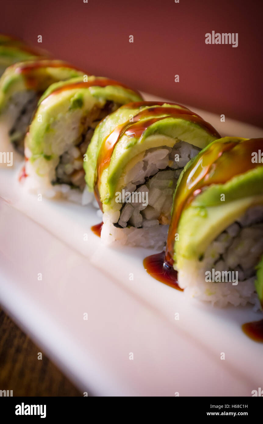 Eel avacado dragon roll with sushi bbq sauce Stock Photo - Alamy