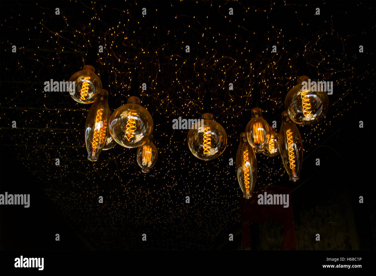 Decorative antique edison style hanging light bulbs Stock Photo - Alamy