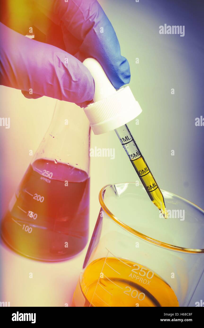 Close up glass measuring beaker for science experiment background Stock ...