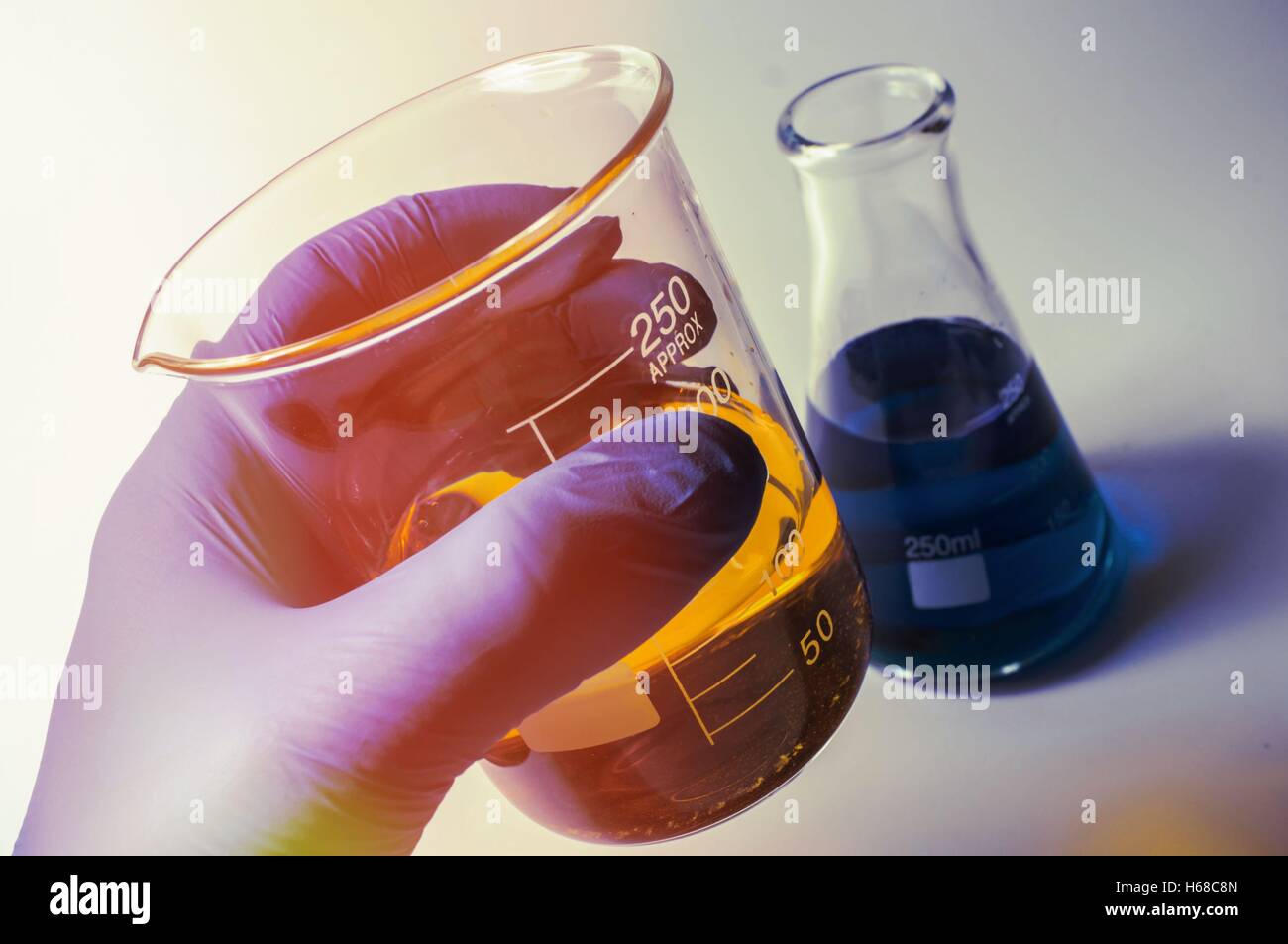 Close up glass measuring beaker for science experiment background Stock ...