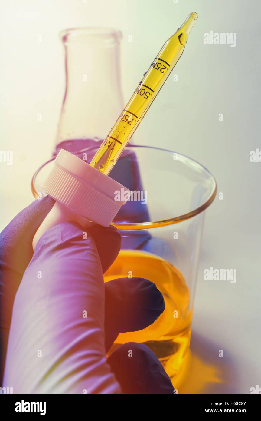 Close up glass measuring beaker for science experiment background Stock ...