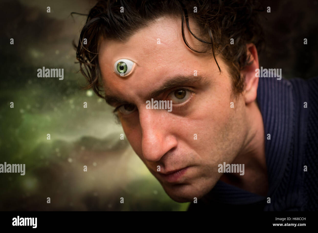Handsome male fortune teller with magic third eye Stock Photo - Alamy