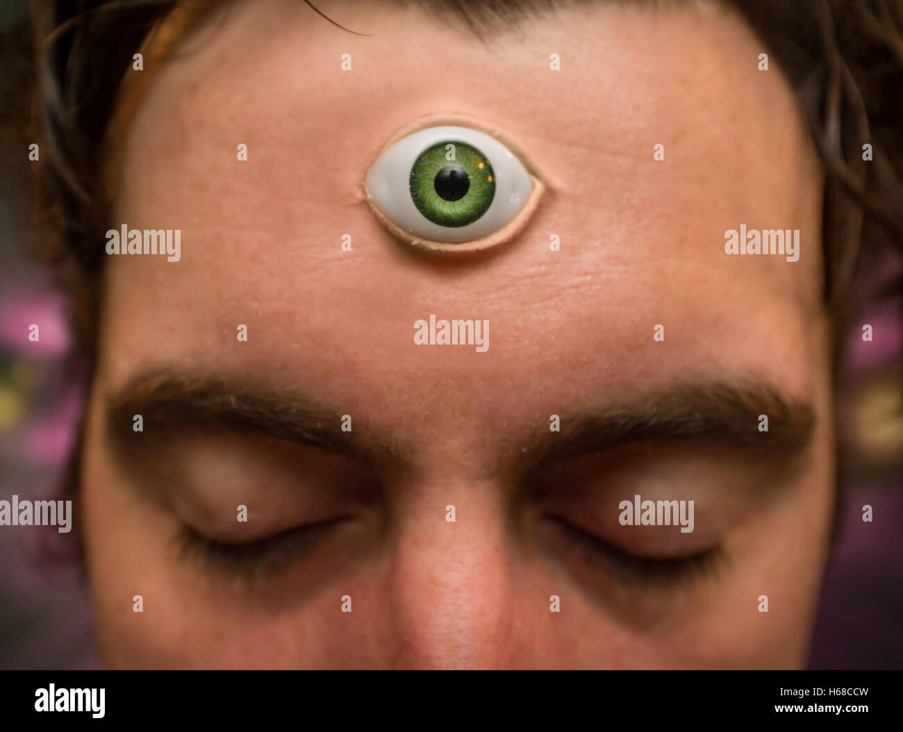 Handsome male fortune teller with magic third eye Stock Photo - Alamy