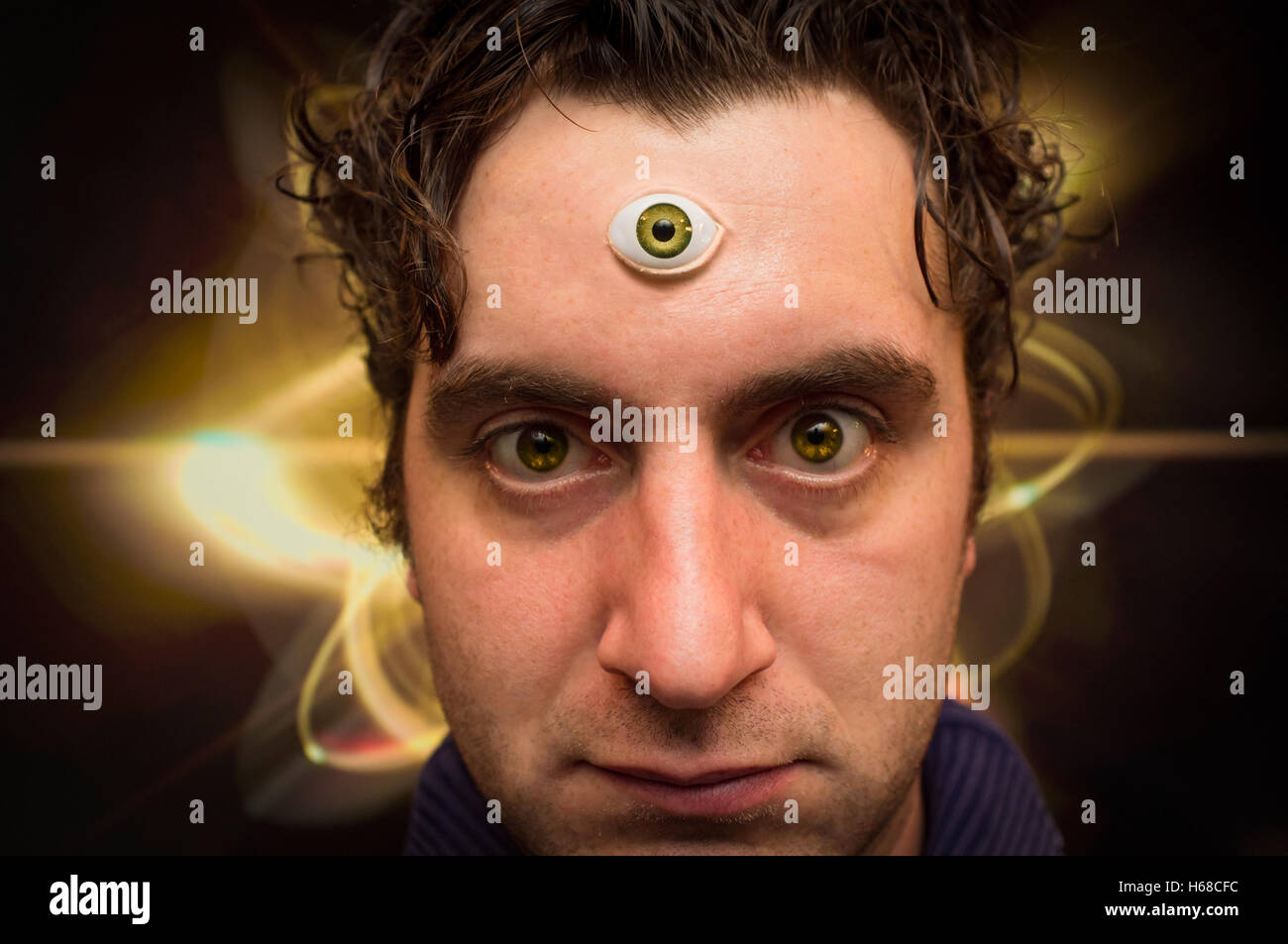 Handsome male fortune teller with magic third eye Stock Photo - Alamy