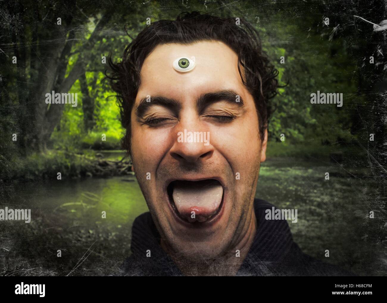 Handsome male fortune teller with magic third eye Stock Photo - Alamy