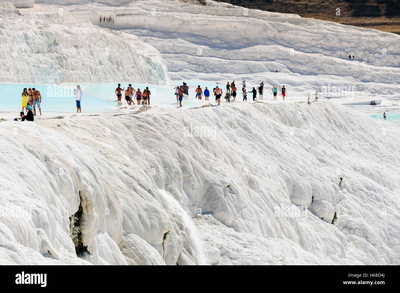 Visitors bathing in the thermal springs pools water at Pamakkule ...