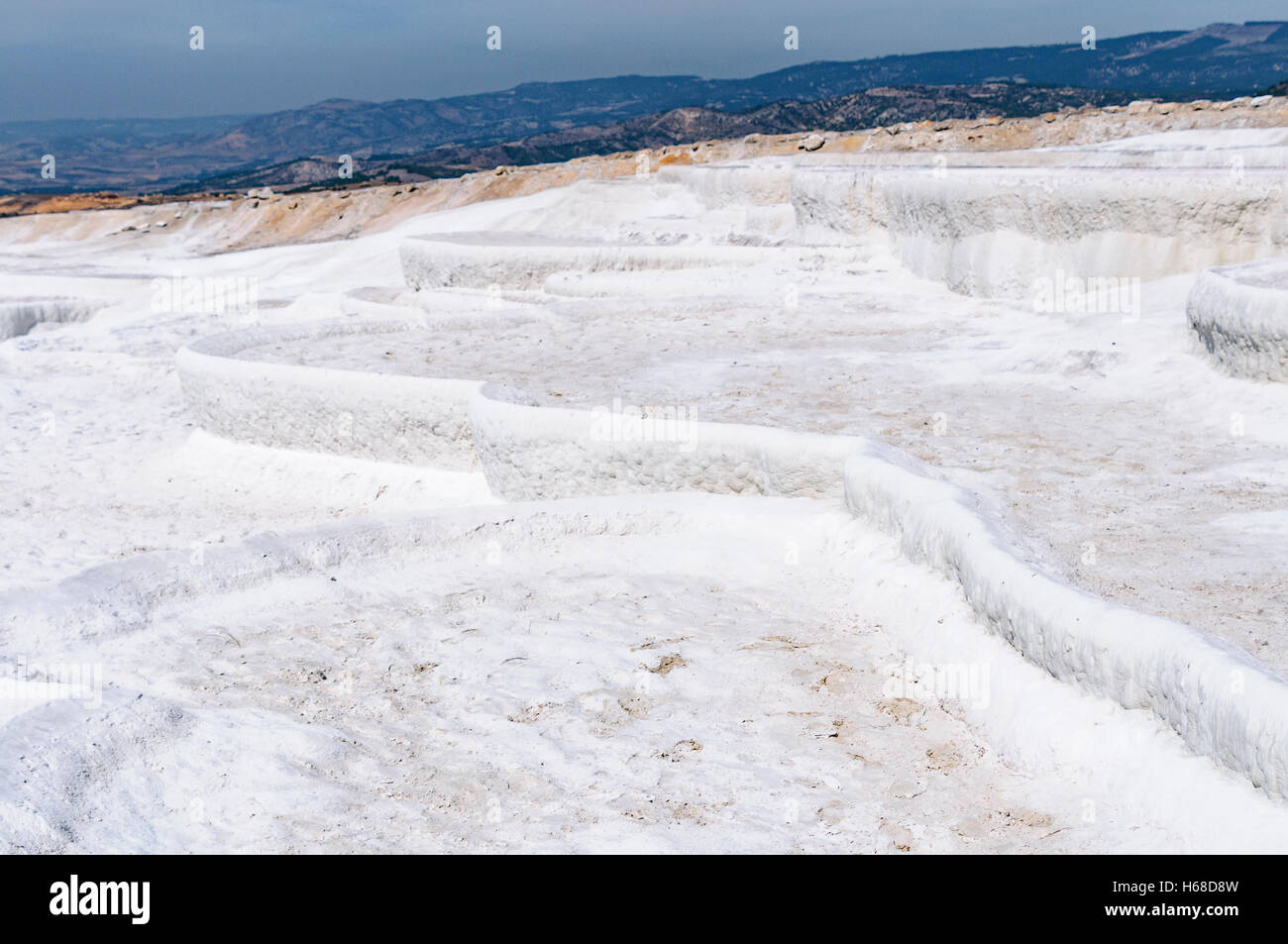 Terraced travertines at the thermal springs pools water at Pamakkule ...