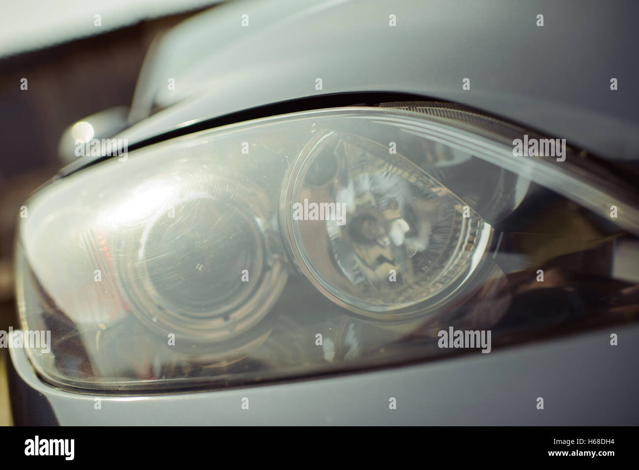 Closeup of front car xenon headlight with lights reflections Stock ...