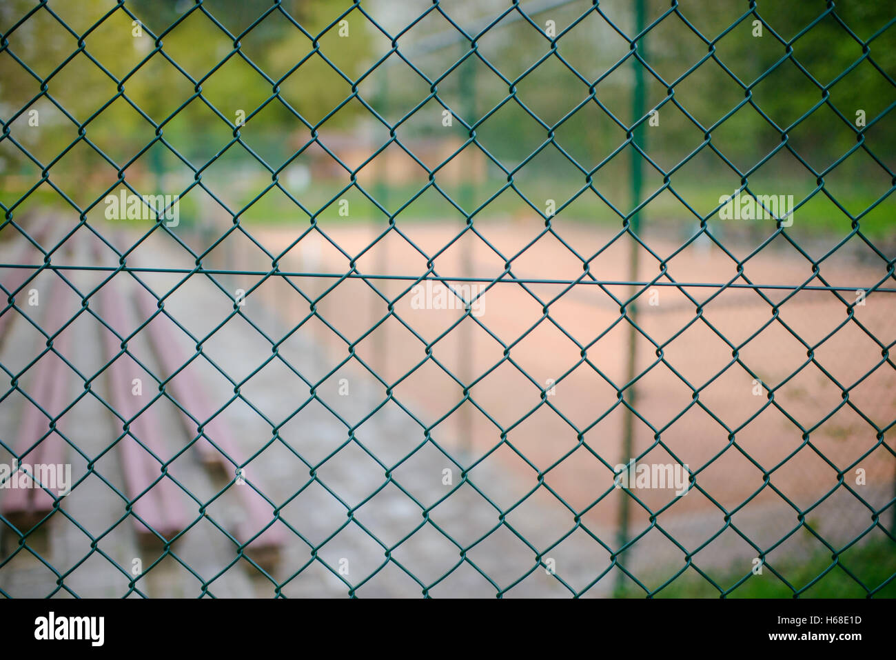 Green chain link park fence close up Stock Photo - Alamy