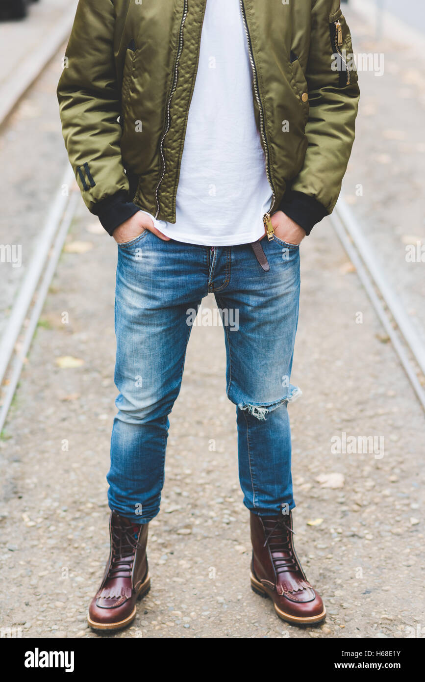 From the neck down view of young fashionable man outdoor in the city ...